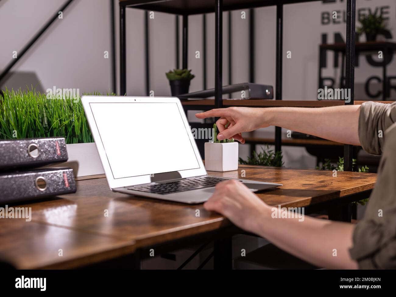 Finger pointing, showing at blank screen mockup, template of laptop ...