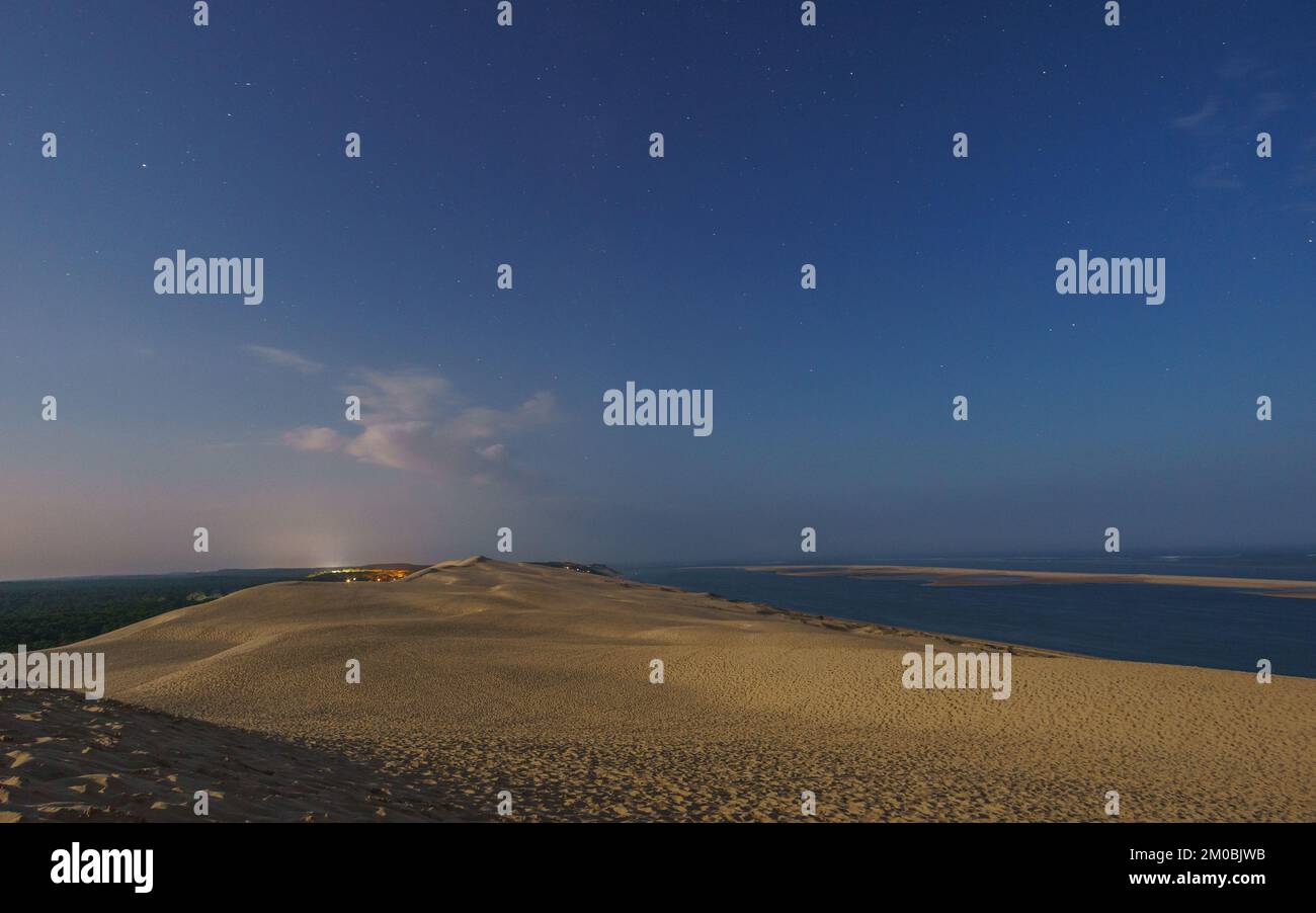Night with stars in the sky on a huge natural sand formation Dune du ...