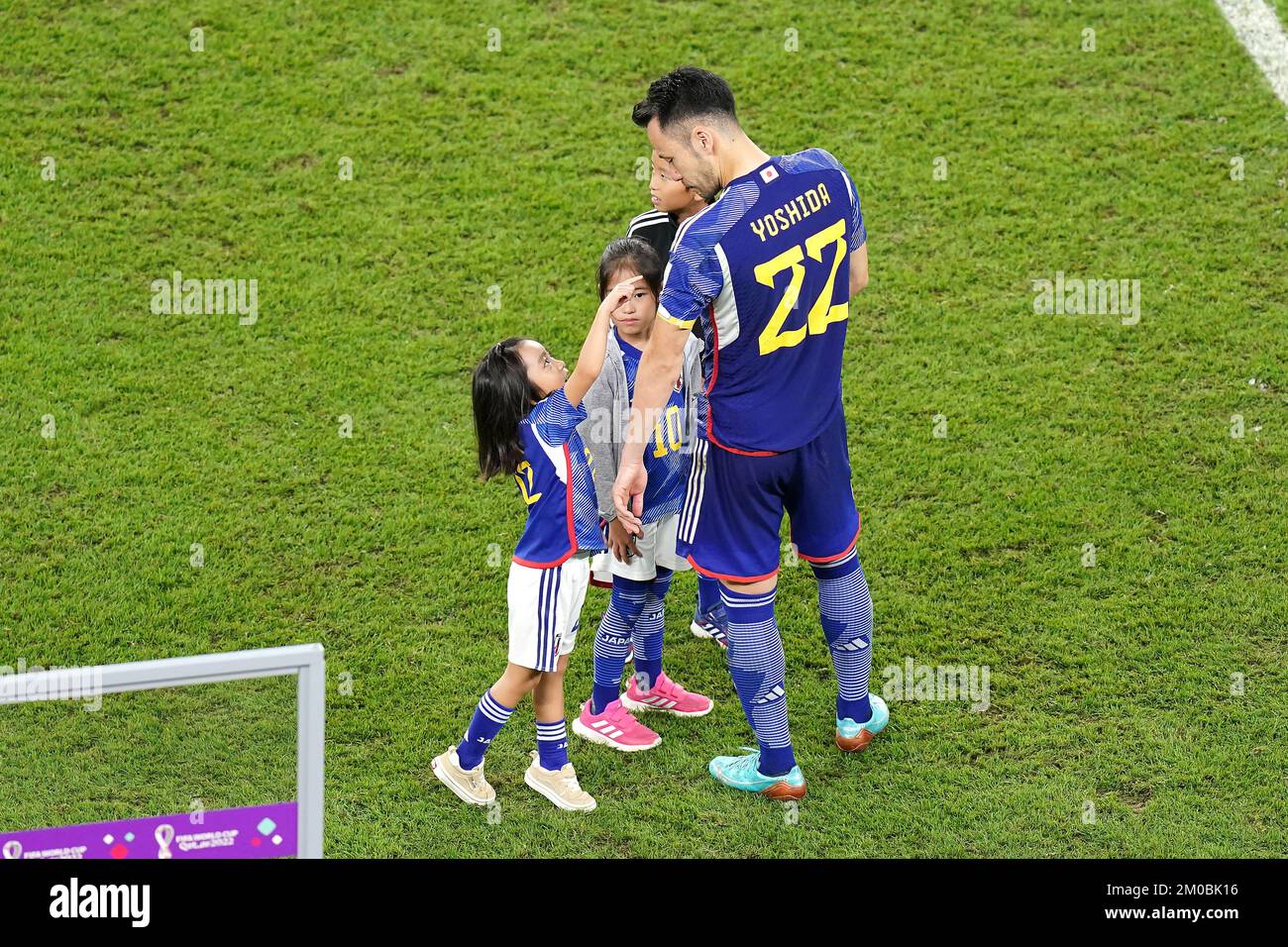 Japan's Maya Yoshida with his family following defeat in the penalty ...