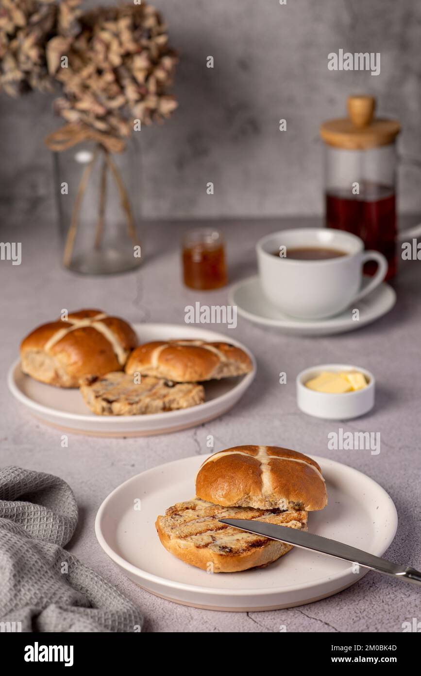 Food photography of hot cross bun, raisin, butter, english, tea, symbol ...