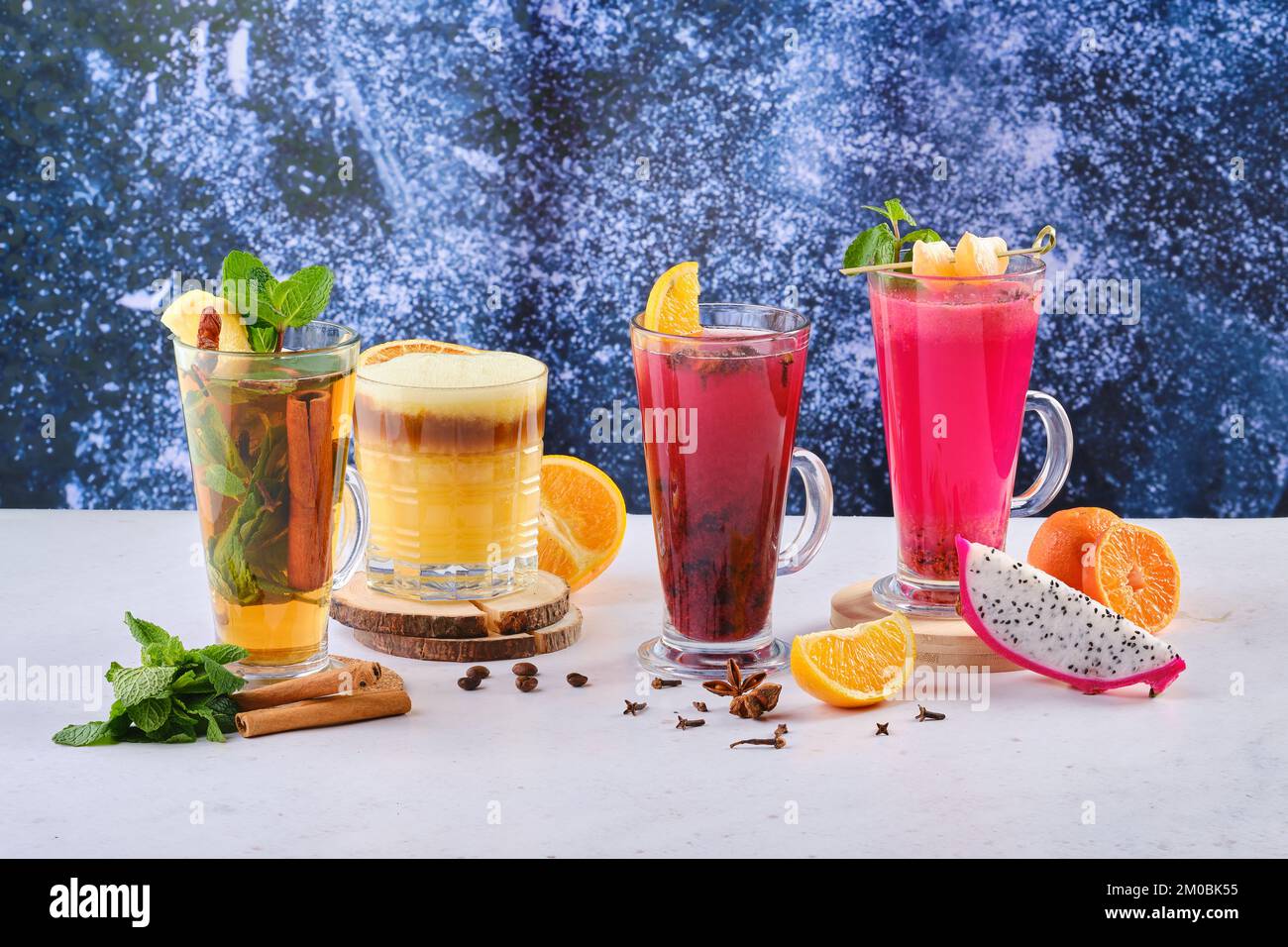 Different hot winter citrus drinks with fruits and aromatic herbs Stock ...