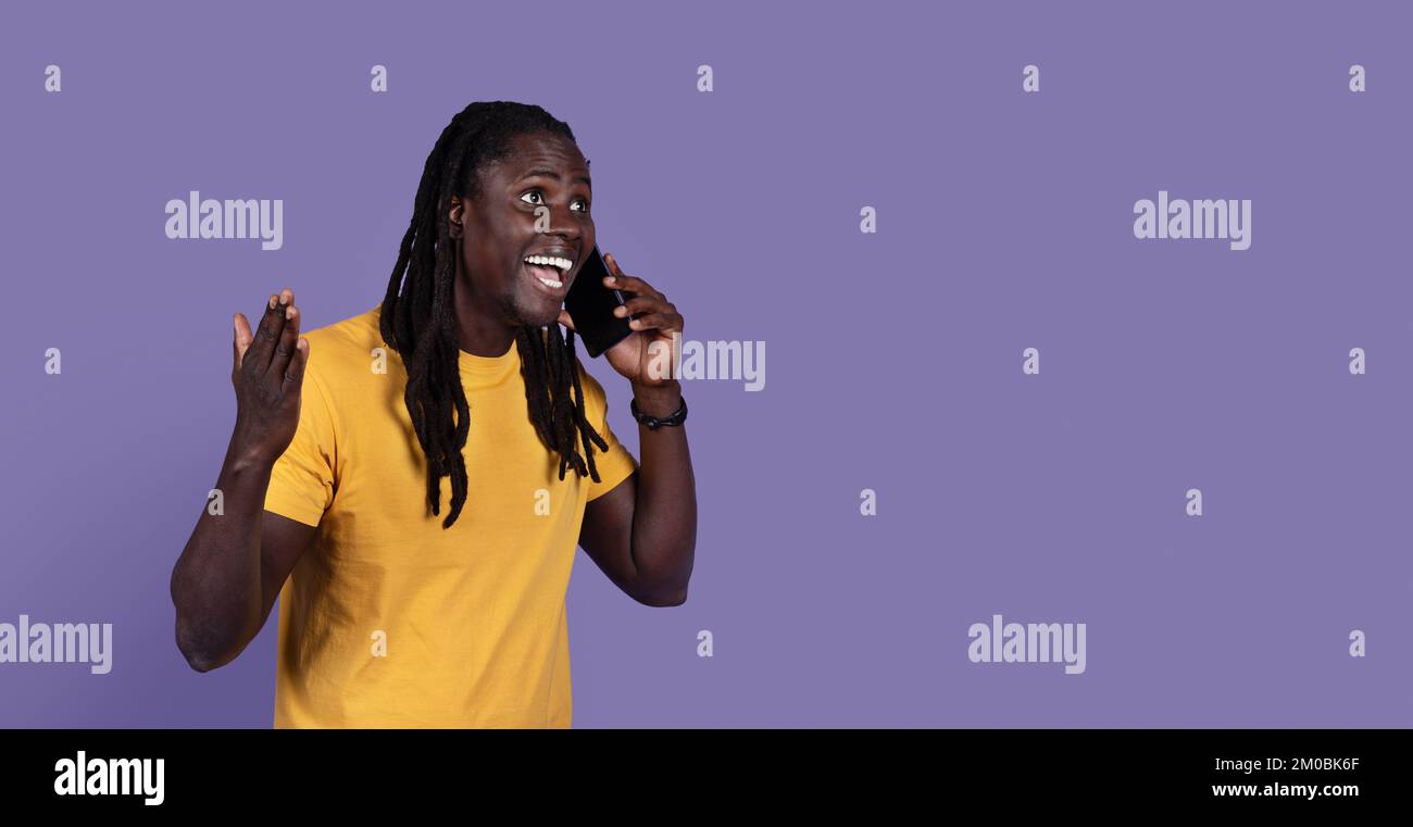 Emotional black guy having phone conversation and gesturing Stock Photo ...