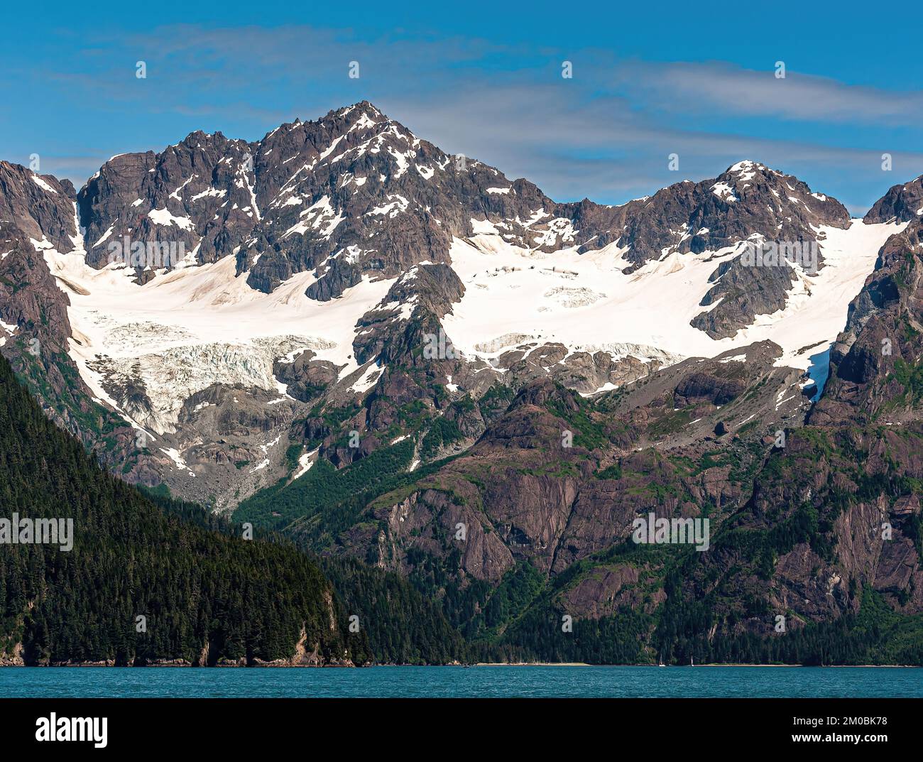 Resurrection Bay, Alaska, USA - July 22, 2011: Rocky shoreline with ...