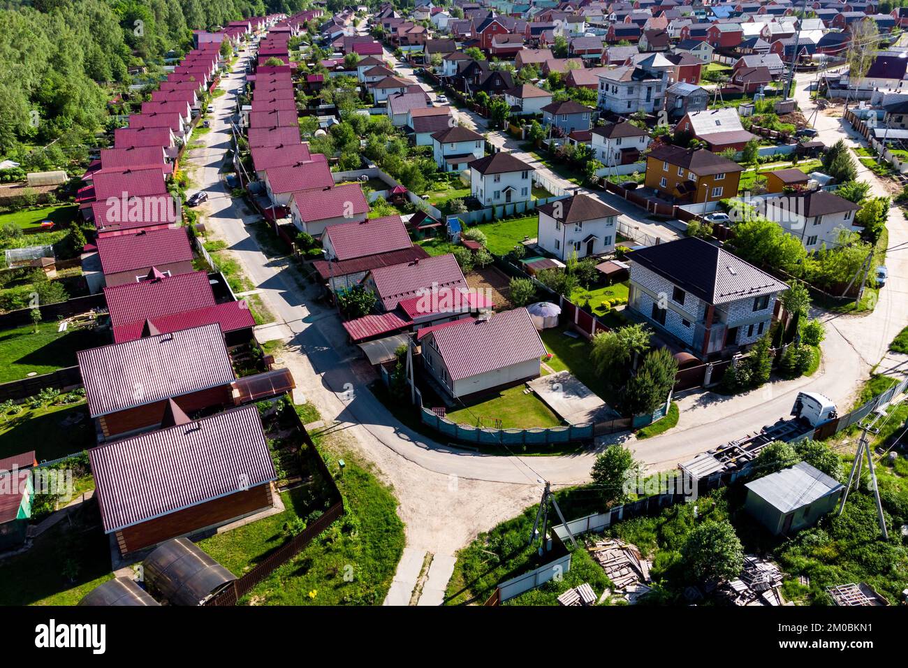 Aerial view of a low-rise standard building in a modern village outside ...