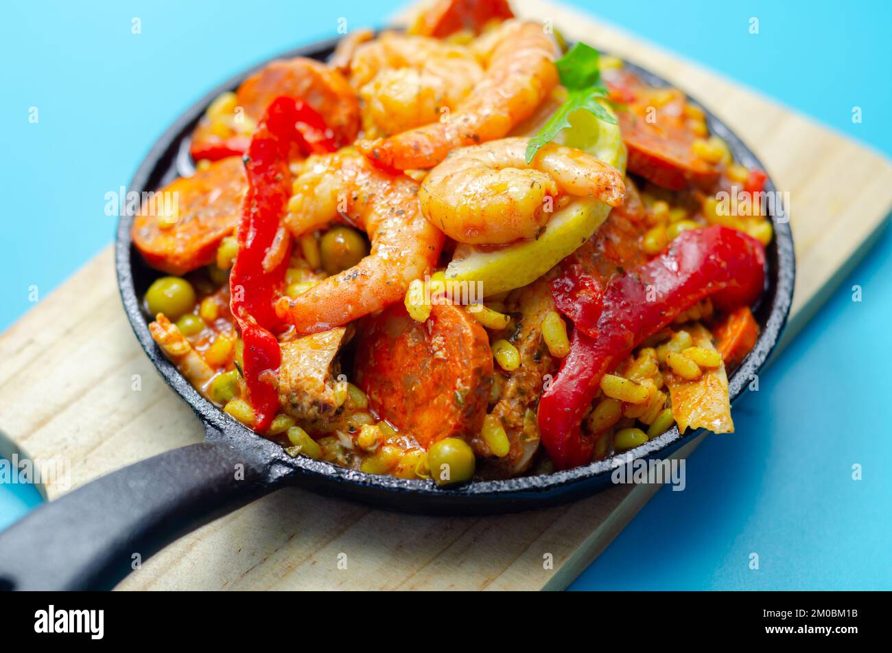 Delicious paella, cooked risotto rice with chicken thigh, king prawns ...