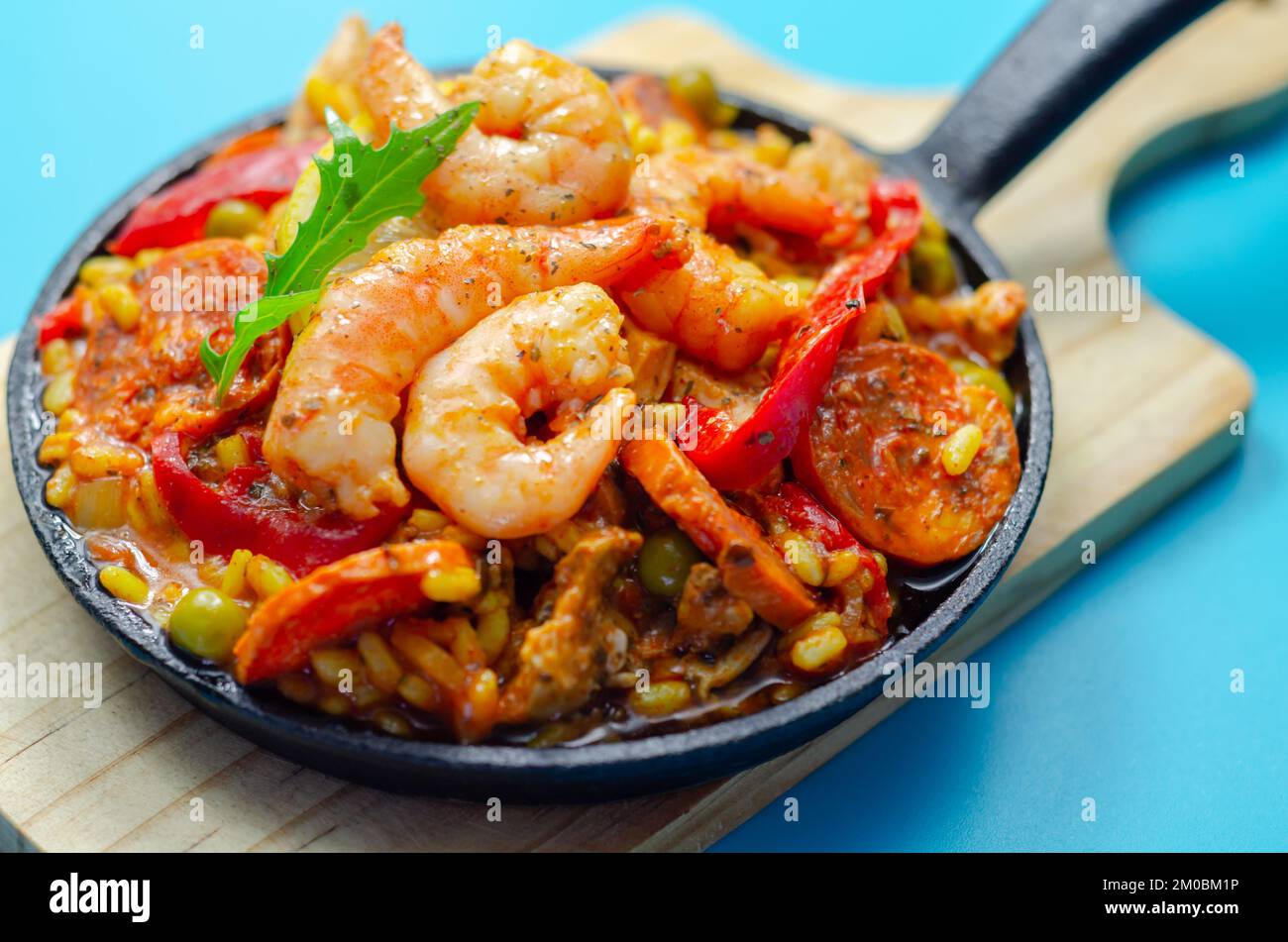 Delicious paella, cooked risotto rice with chicken thigh, king prawns ...