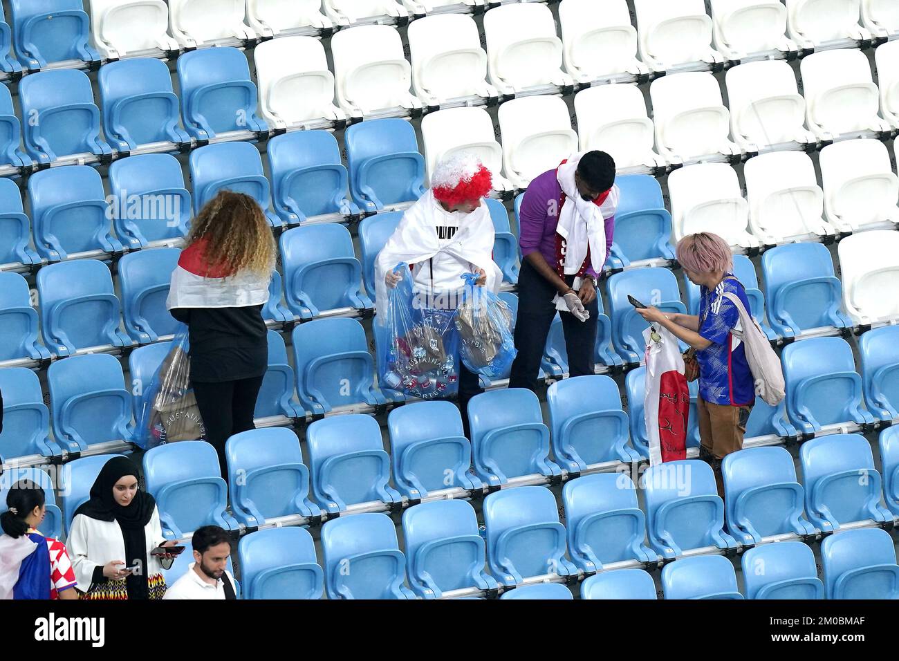 Japan fans clean up after themselves following the FIFA World Cup Round ...