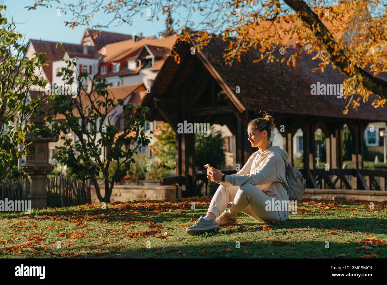 Young Fashionable Teenage Girl With Smartphone In Europian Park In ...