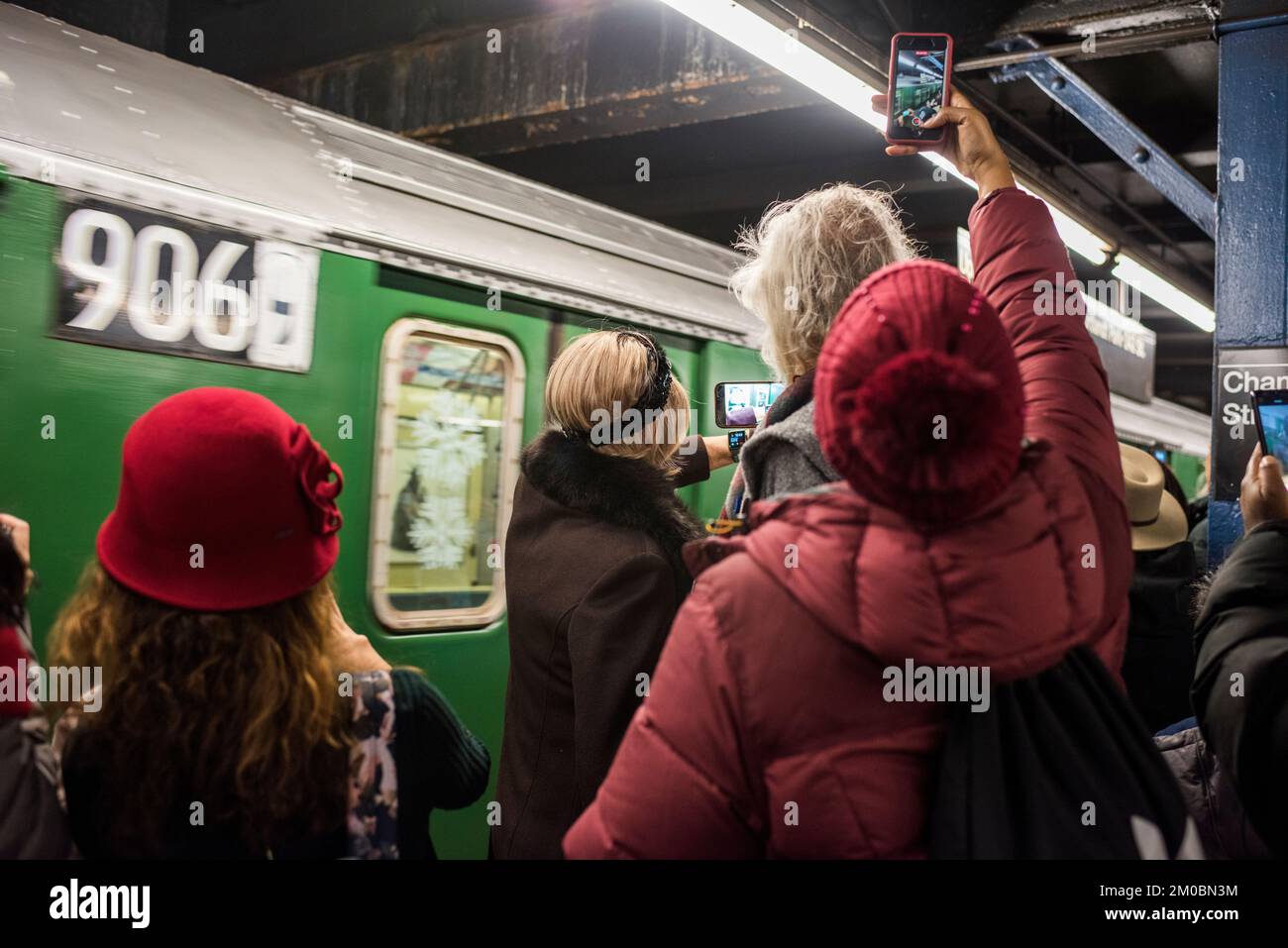 New York City, New York - December 4, 2022: People getting on the Train of Many Colors, Holiday ...