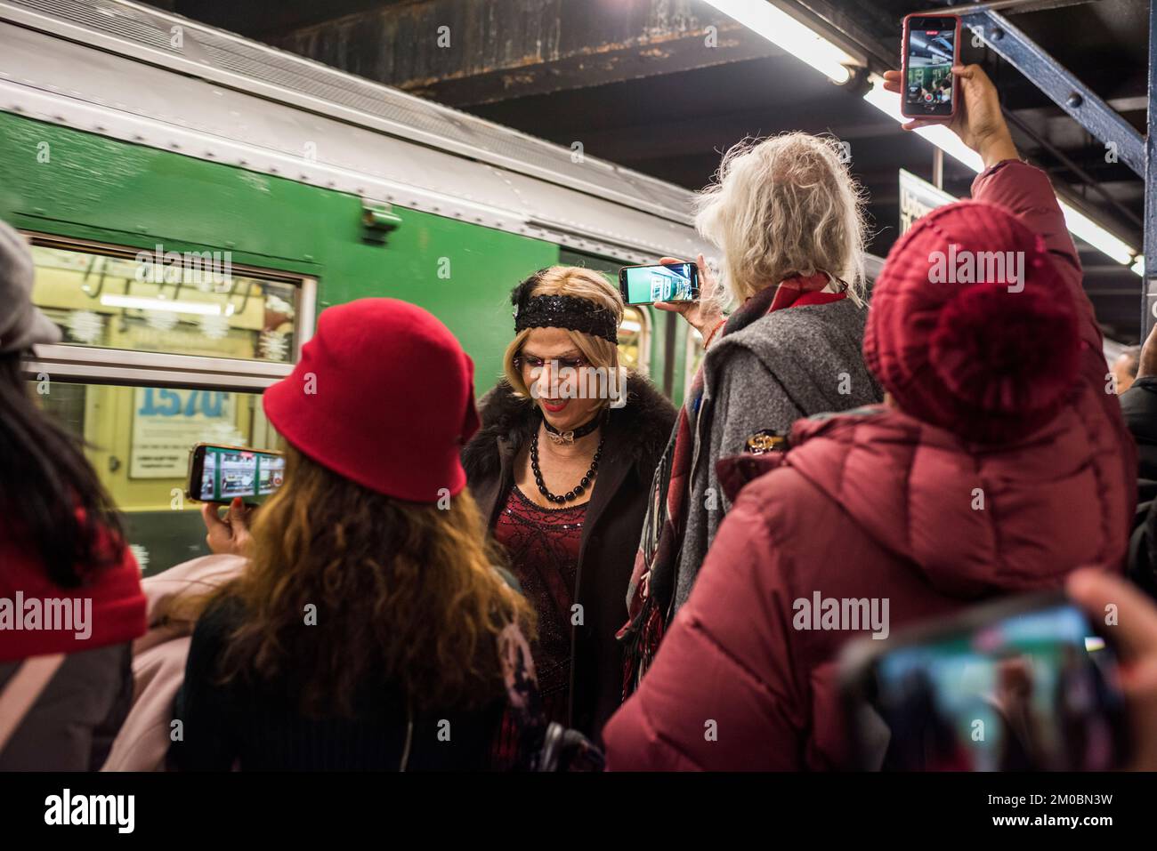 New York City, New York - December 4, 2022: People getting on the Train of Many Colors, Holiday ...
