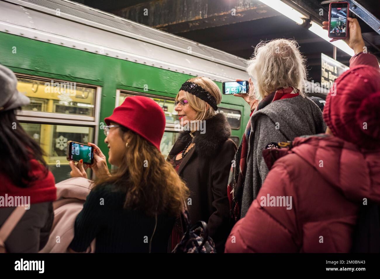 New York City, New York - December 4, 2022: People getting on the Train of Many Colors, Holiday ...
