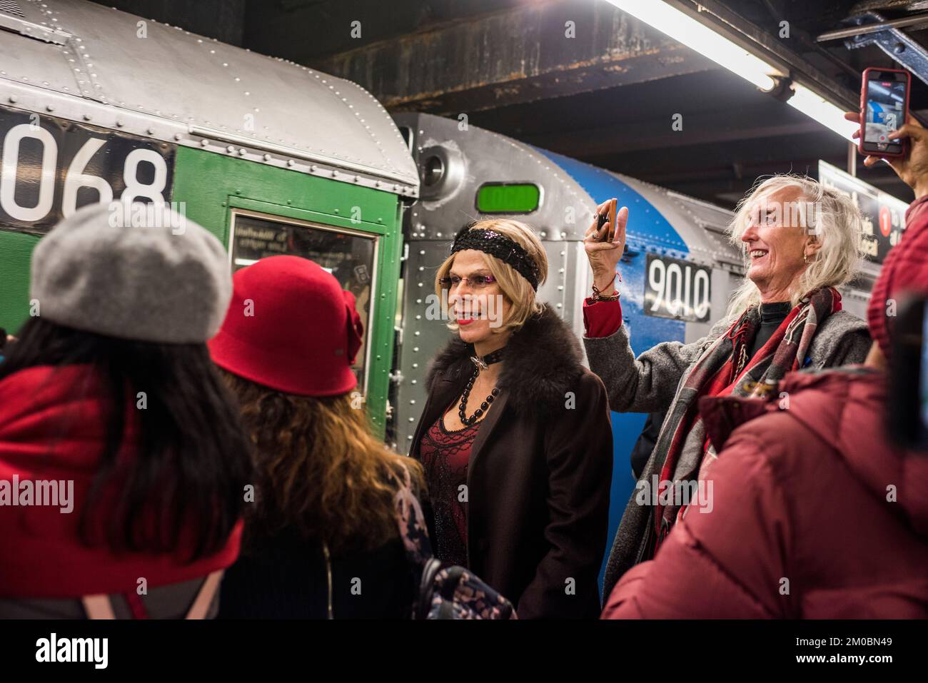 New York City, New York - December 4, 2022: People getting on the Train of Many Colors, Holiday ...