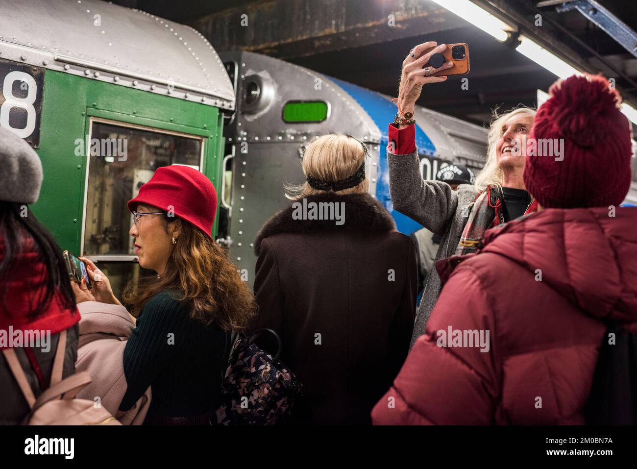 New York City, New York - December 4, 2022: People getting on the Train of Many Colors, Holiday ...