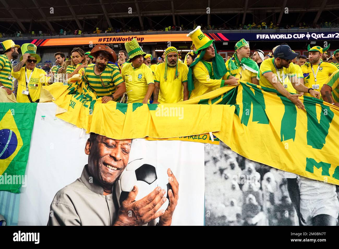 Brazil fans in the stands above a banner featuring former Brazil player ...