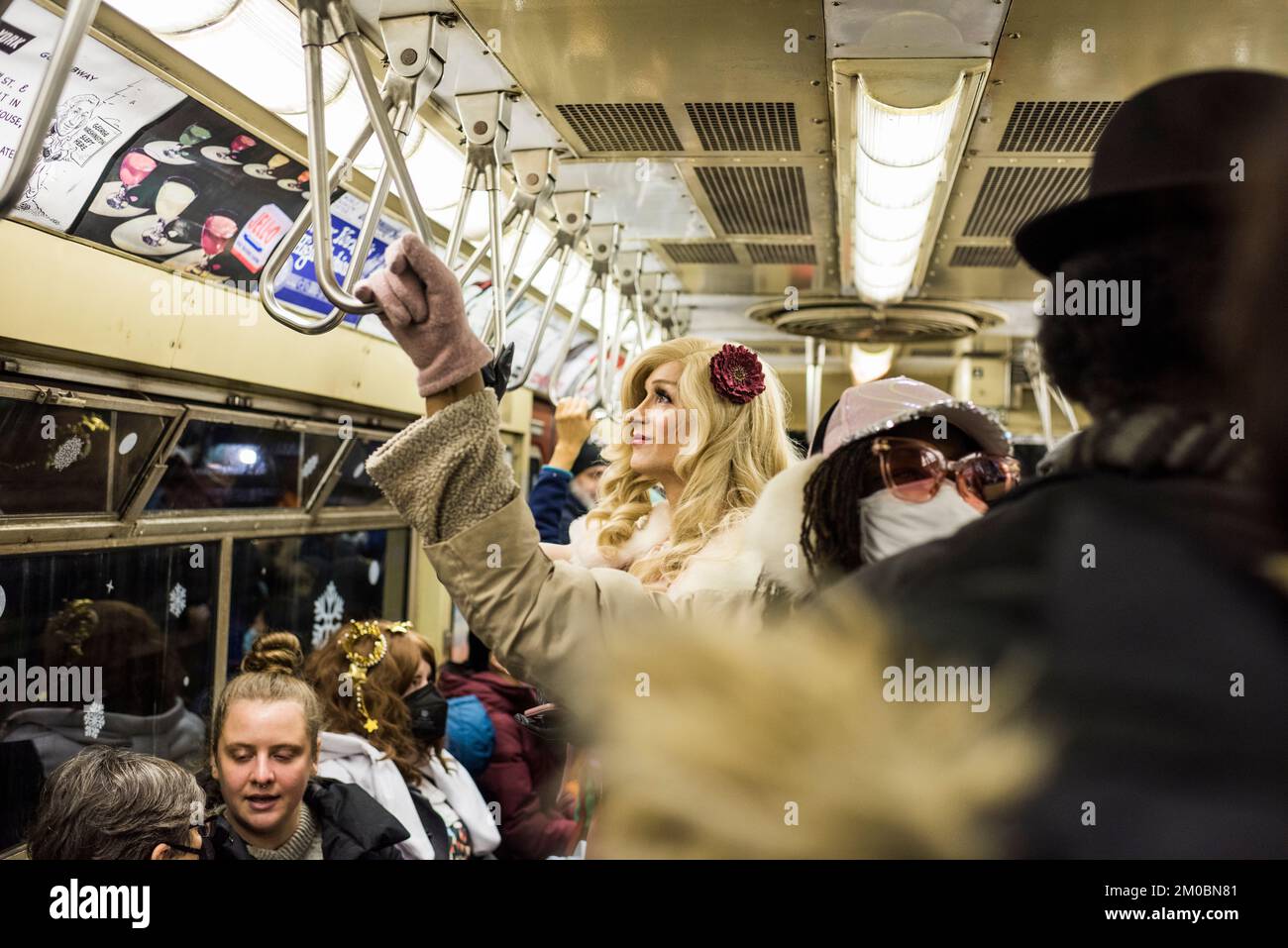 New York City, New York - December 4, 2022: People riding the Train of Many Colors, Holiday ...