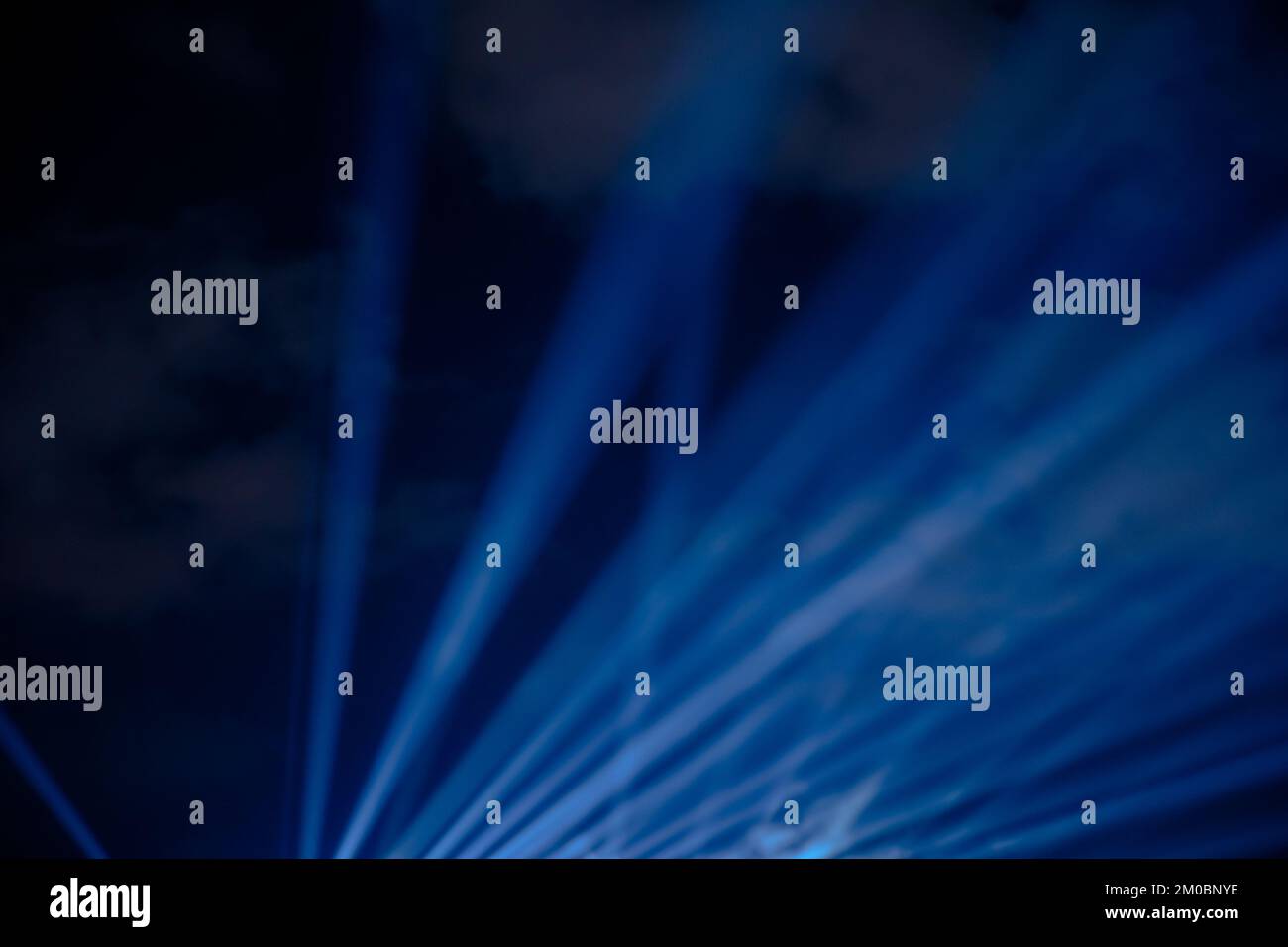 Blue spotlights in outdoor. Spotlight rays background. Night event ...