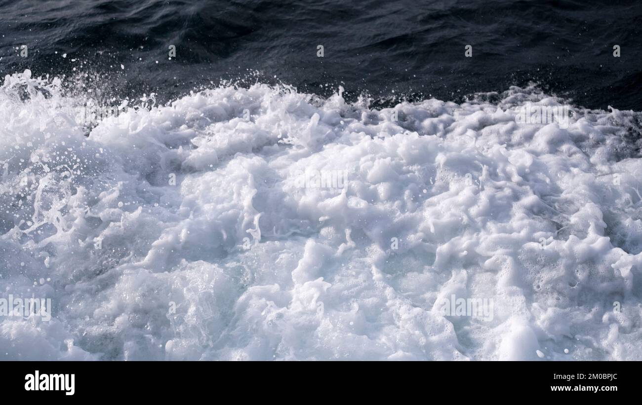 Abstract blue sea water with white foam for background, nature ...