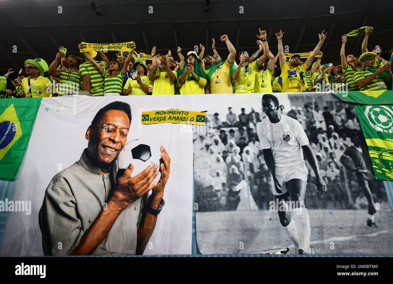Doha, Qatar, 5th December 2022. Brazil fans with a banner depicting ...