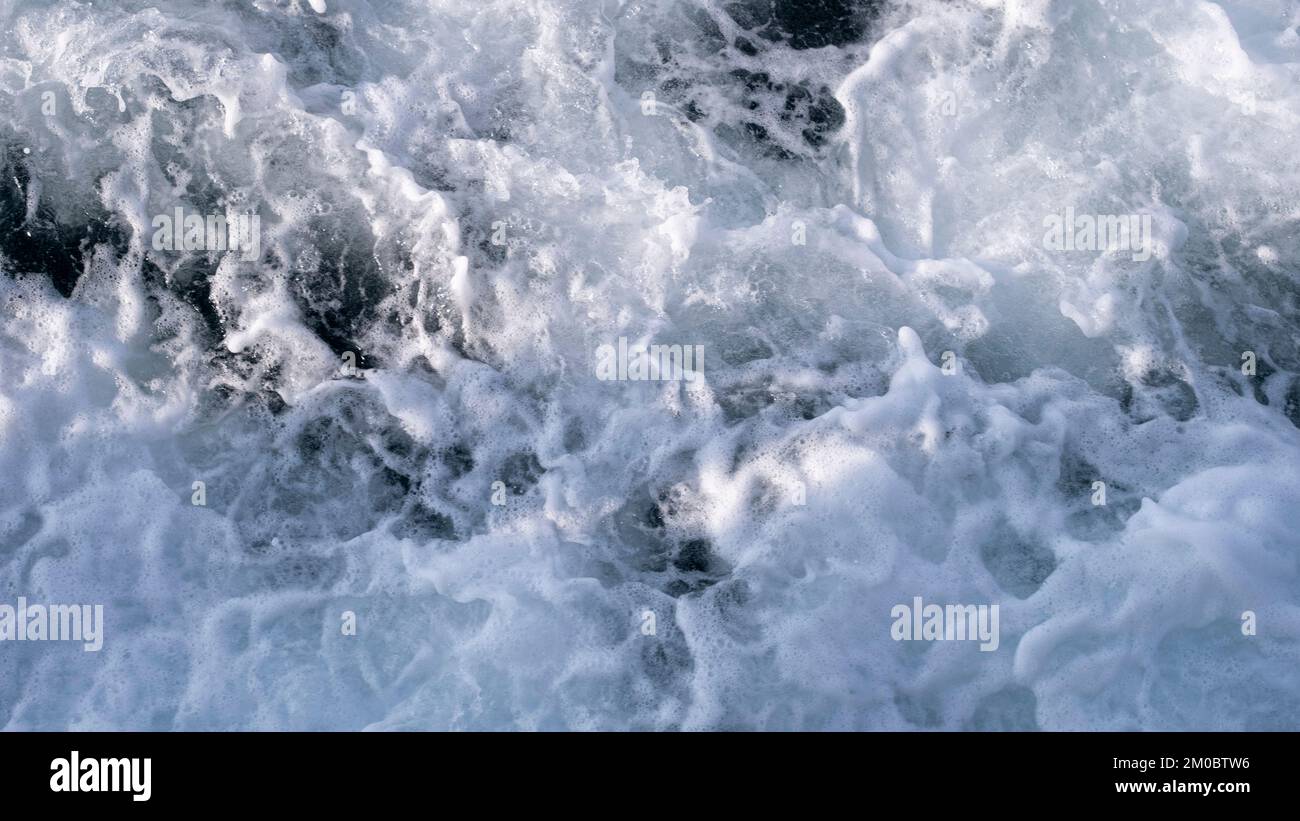 Abstract blue sea water with white foam for background, nature ...