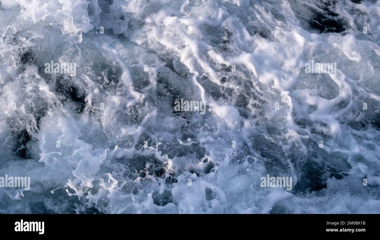 Abstract blue sea water with white foam for background, nature ...