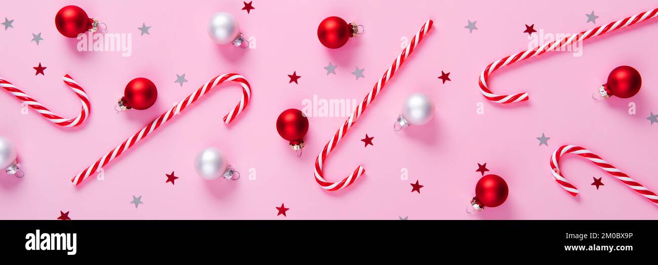 Christmas banner. Creative holiday pattern made of candy canes and ...