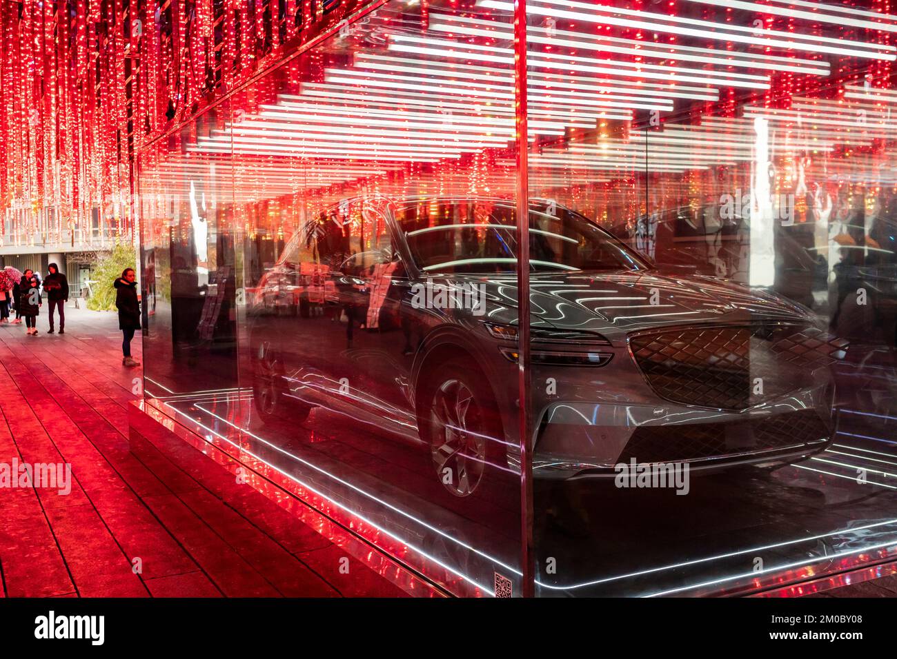 A 2023 Genesis Electrified GV70 electric vehicle displayed in its own ...