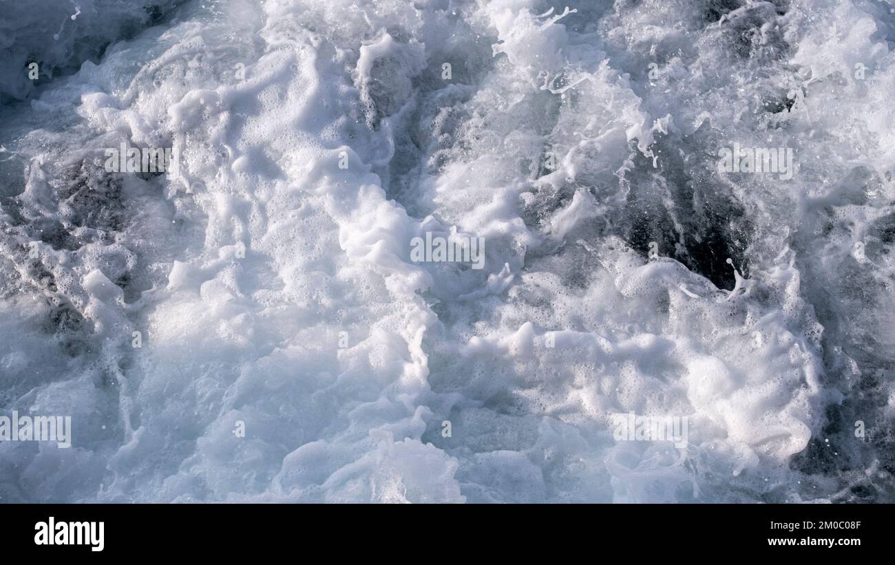Abstract blue sea water with white foam for background, nature ...