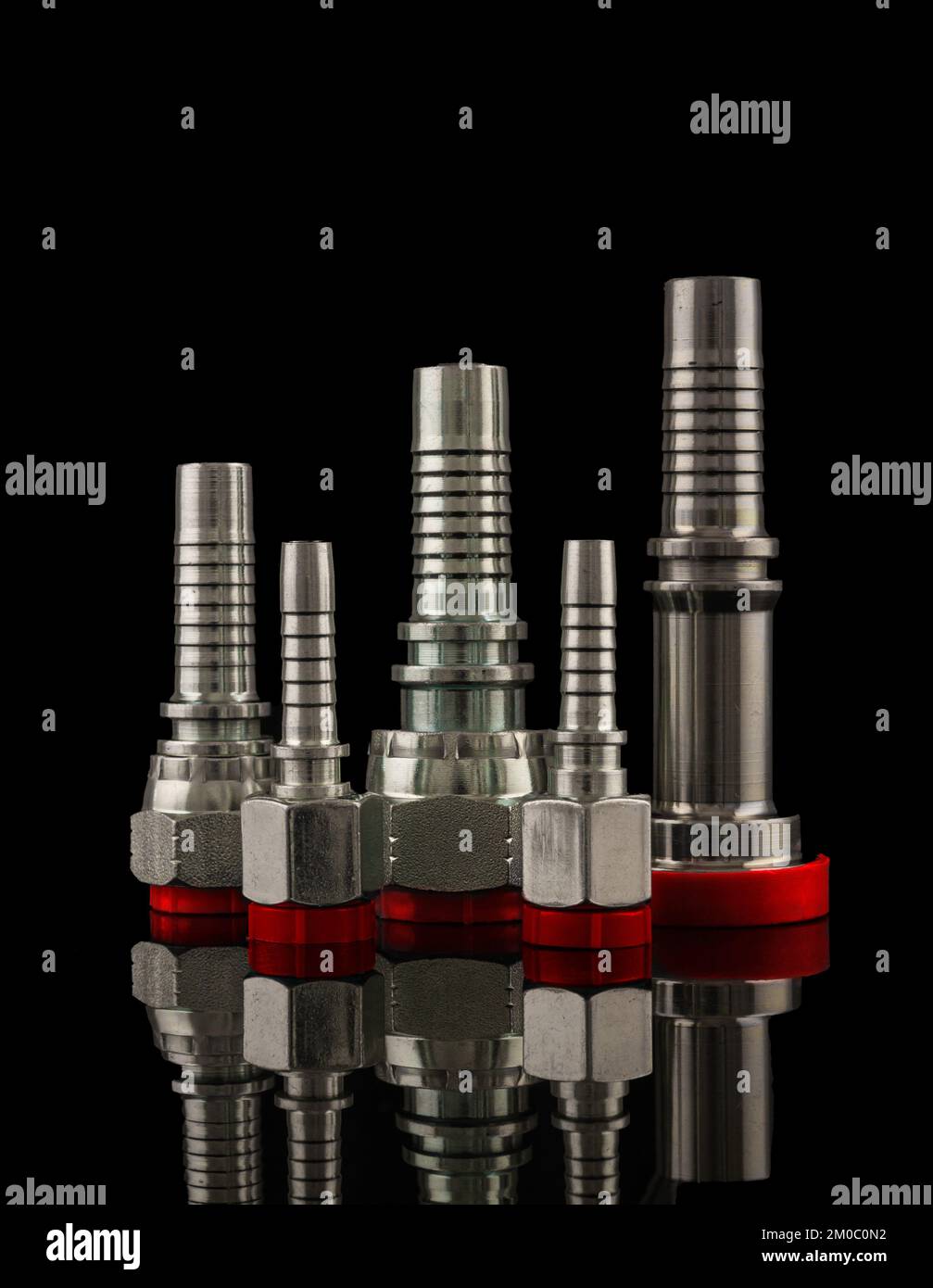 Set of fittings, quick couplings for hose isolated on black background ...