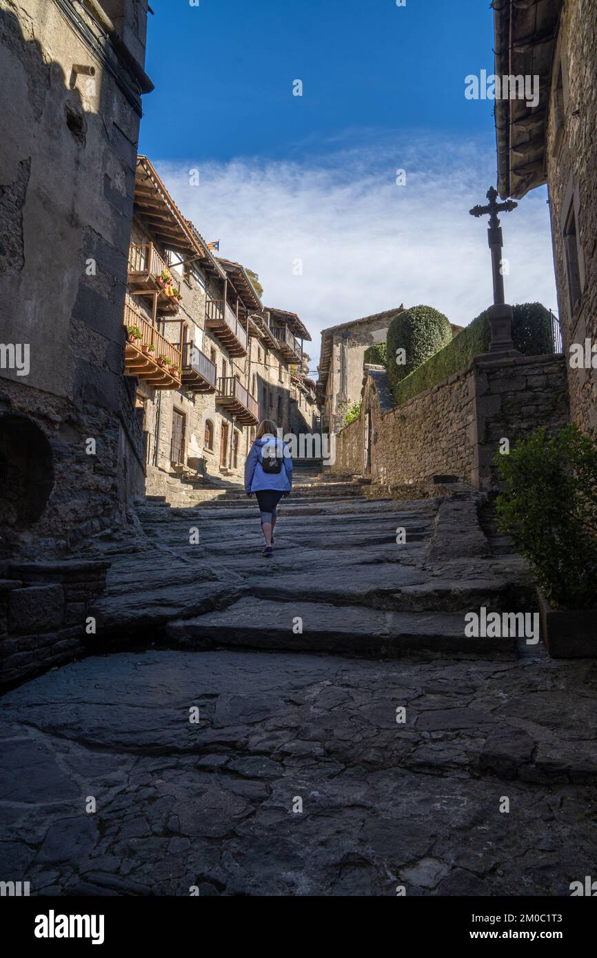 Tourist woman climbing from below a beautiful street with stairs of a ...