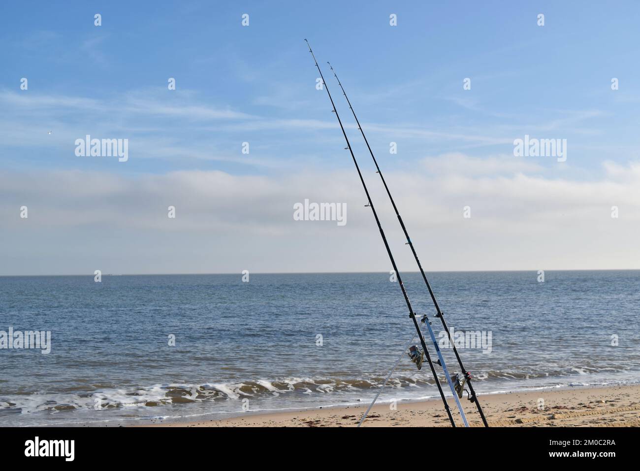 Fishing rods on North sea beach Stock Photo - Alamy