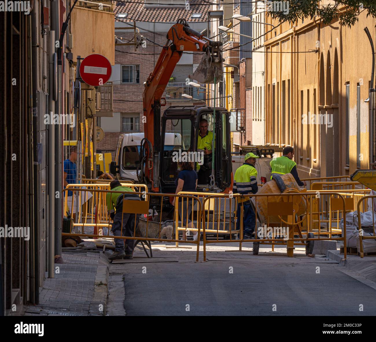 Workers working on public works in a street in Granollers. Protection ...