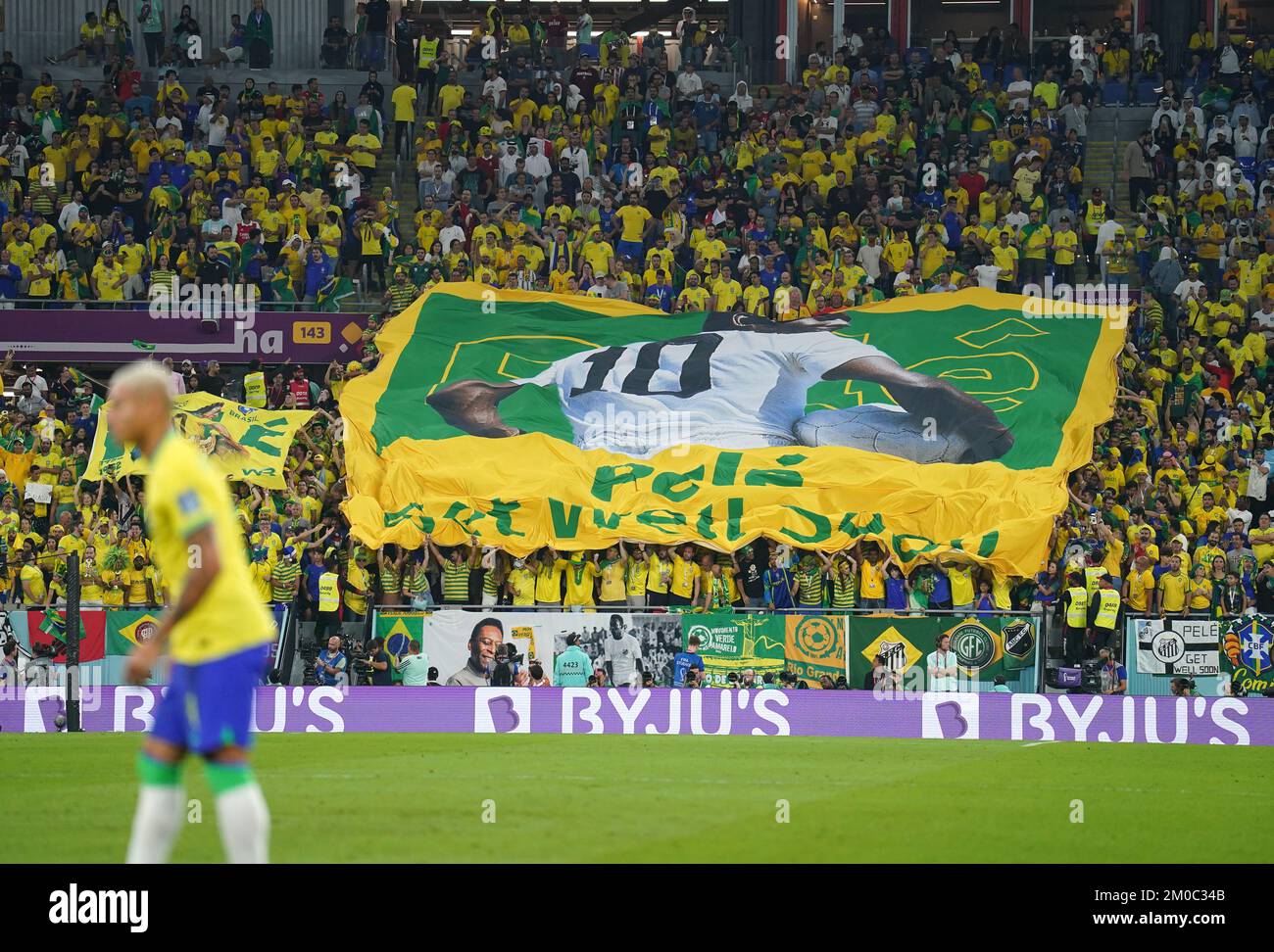 Brazil fans in the stands hold up a banner wishing for former player ...