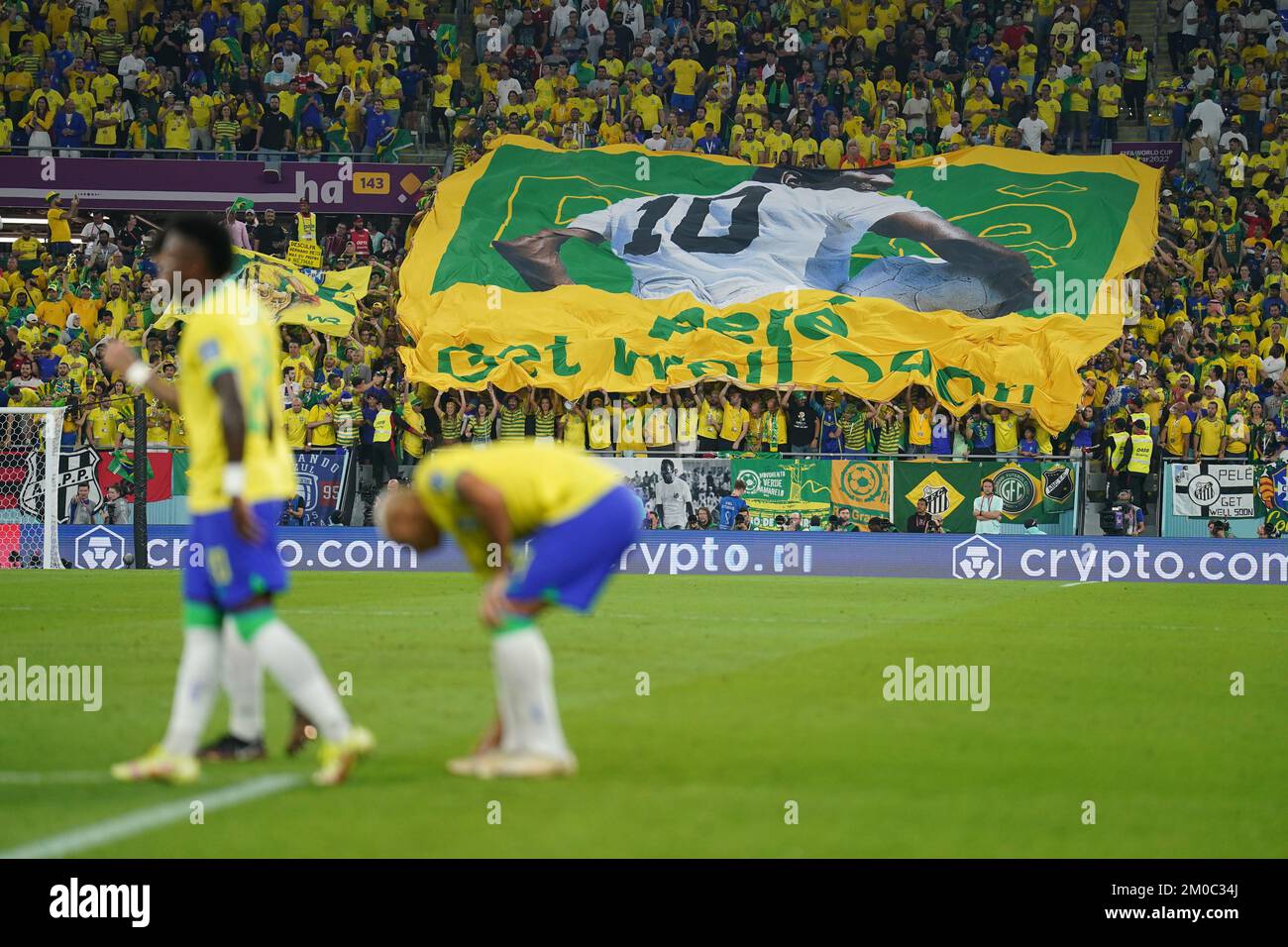 Brazil fans in the stands hold up a banner wishing for former player ...