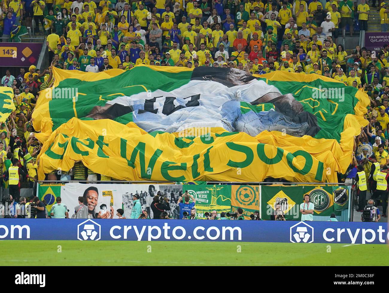Brazil fans in the stands hold up a banner wishing for former player ...
