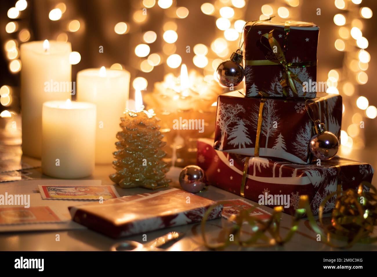 photo presents stand in a vertical row wrapped in festive paper are on ...