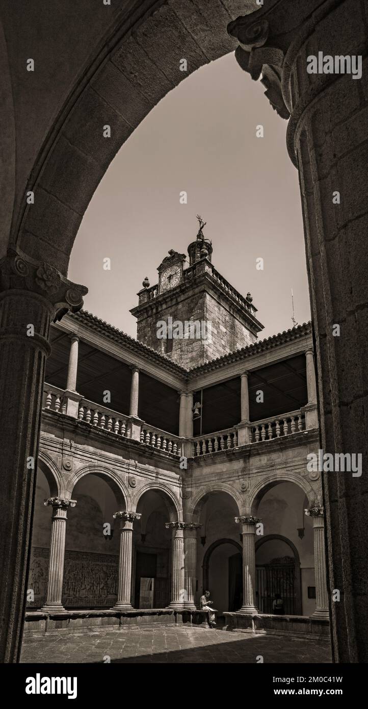 Ornate medieval arches and behind the cloister and the blue azulejo ...