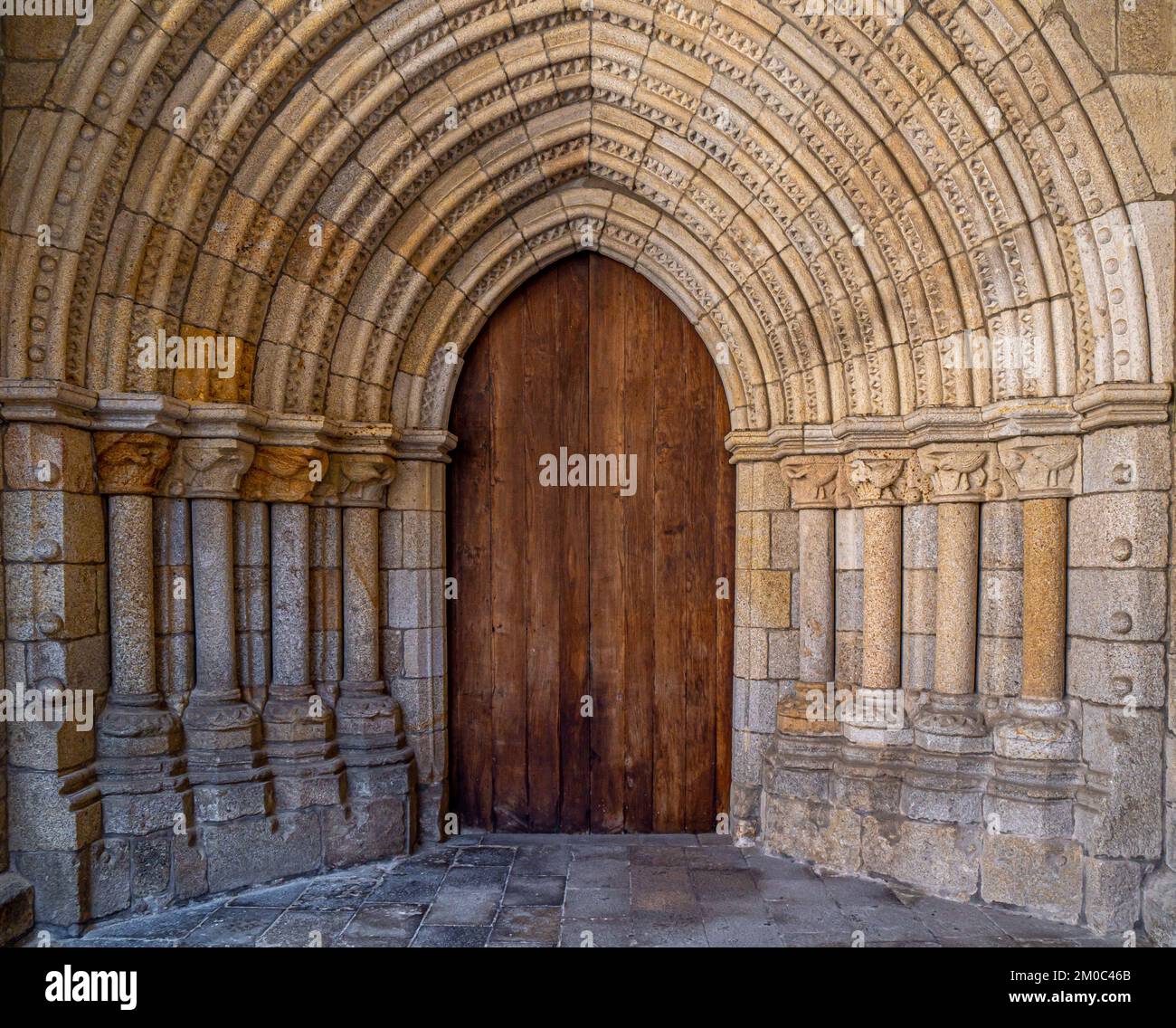 Ornate Romanesque door of the cloister of the Cathedral of Saint Mary ...