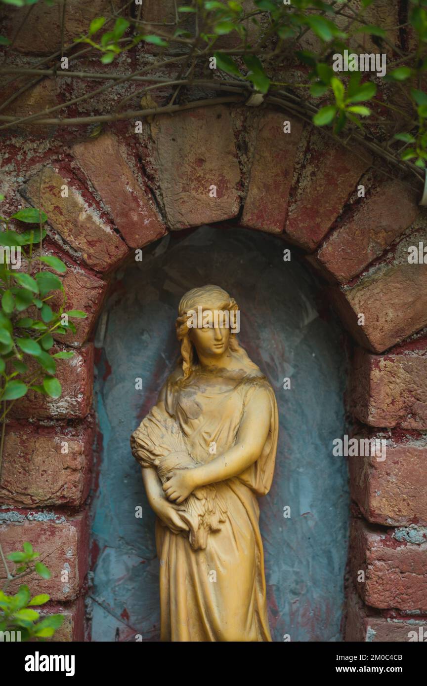 Head of marble statue of roman Ceres or greek Demeter in the park of ...