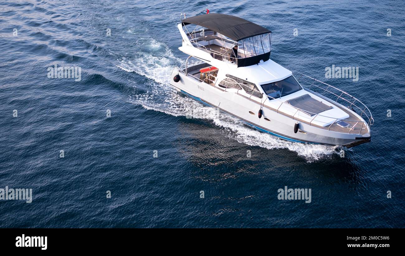 Yacht at sea in Europe. Aerial view of luxury floating ship at sunset ...