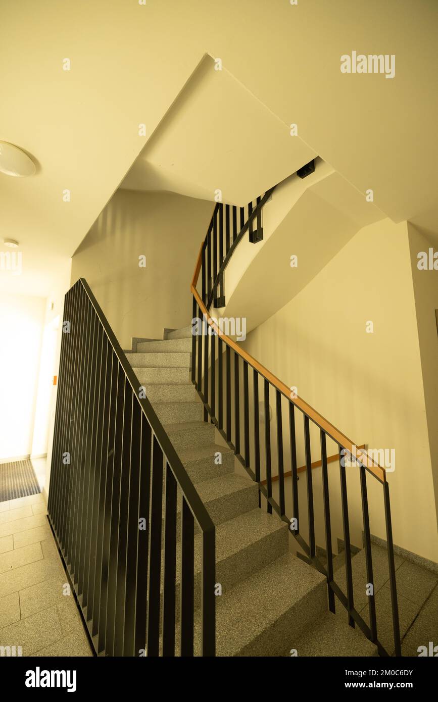Staircase in between two floors leading somewhere Stock Photo - Alamy