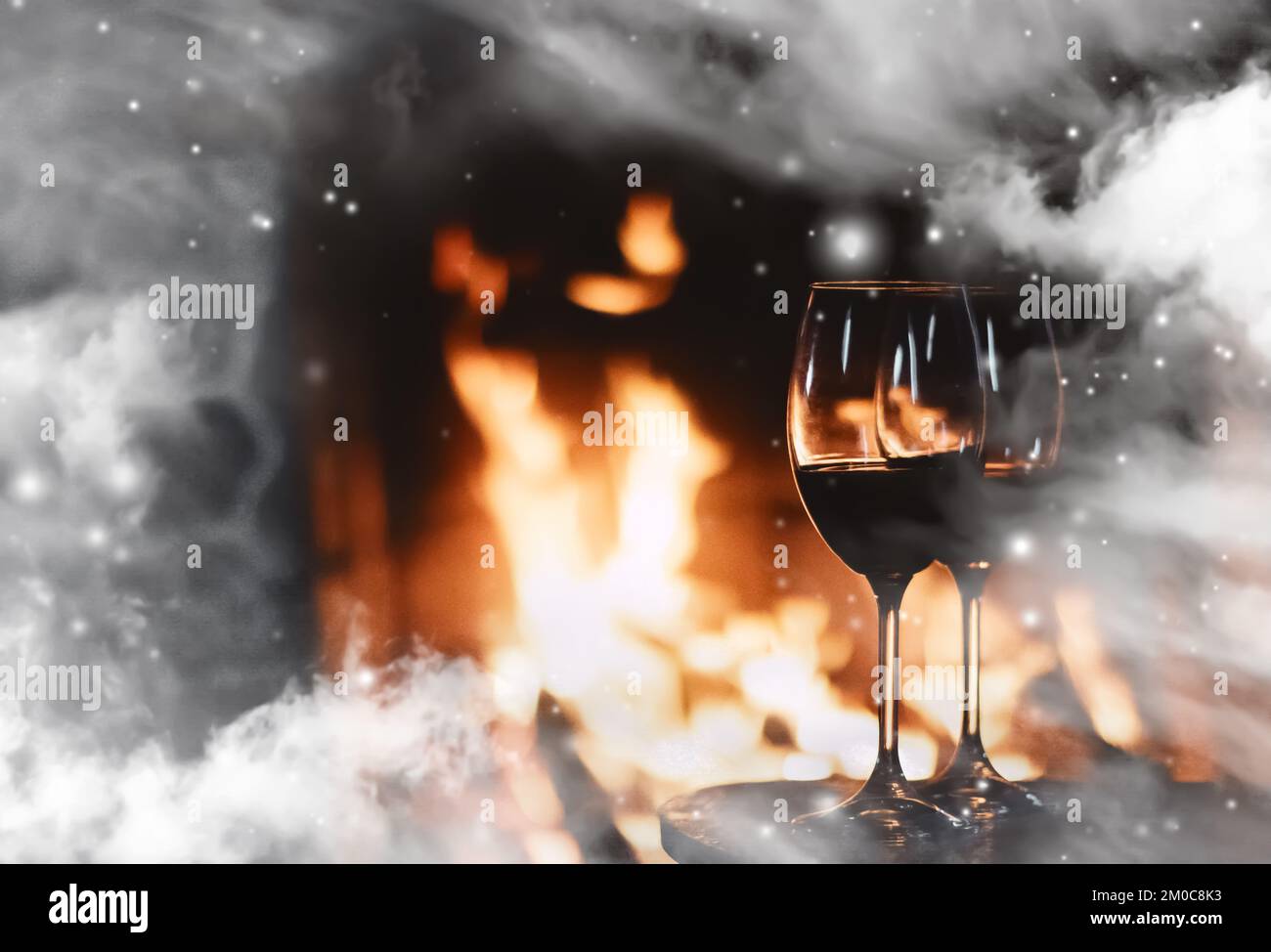 Winter atmosphere and Christmas holiday time, wine glasses in front of ...