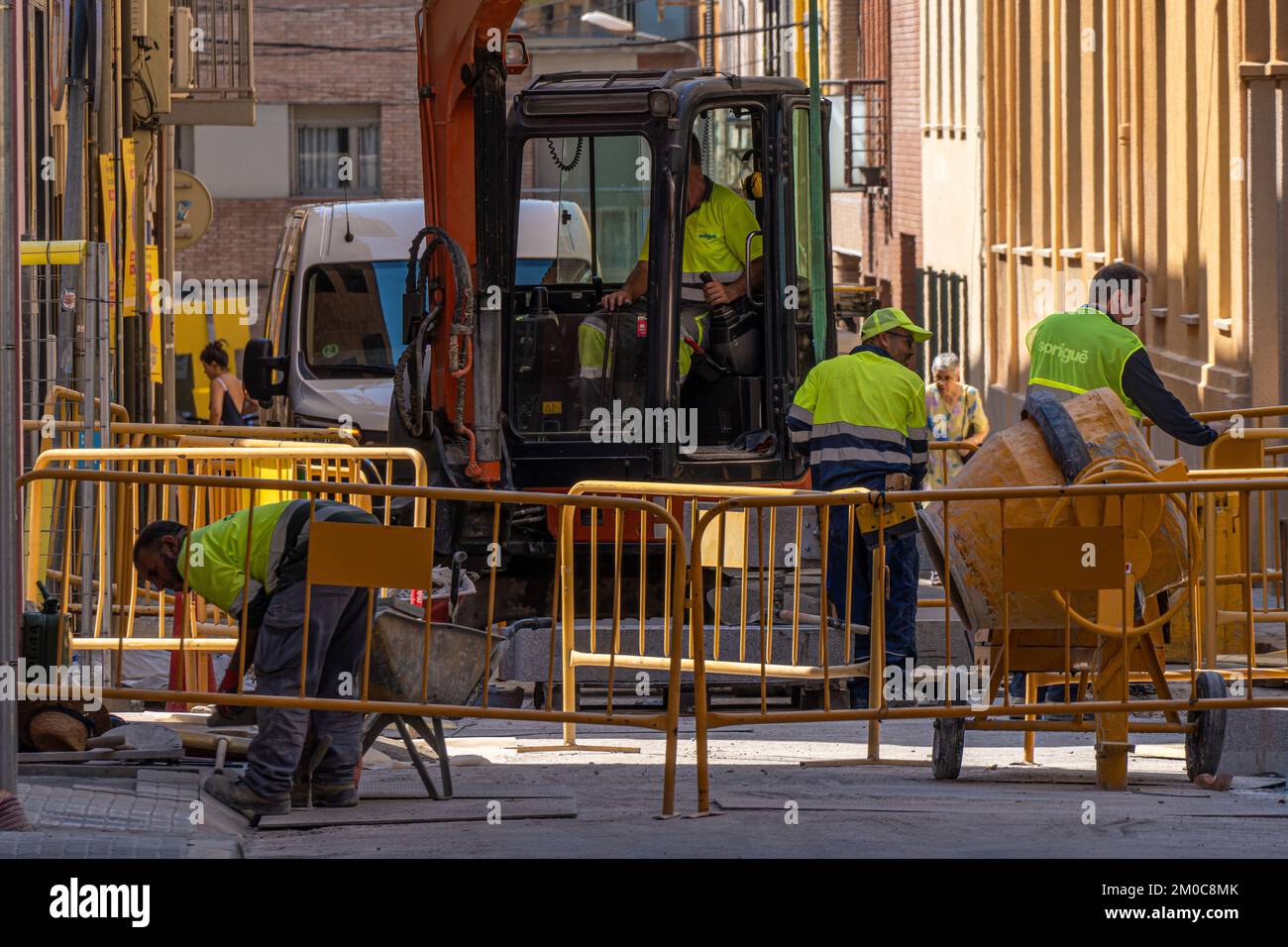 Workers working on public works in a street in Granollers. Protection ...