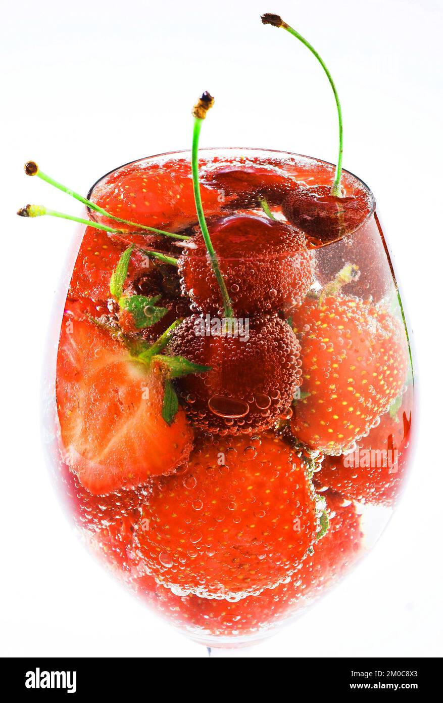 Mixed fruit in a glass of water Stock Photo - Alamy