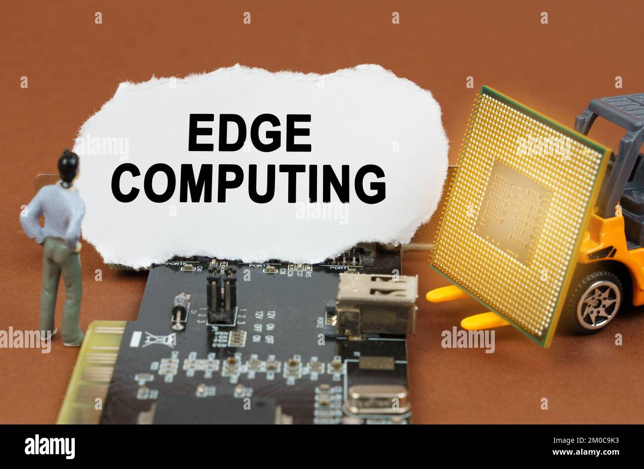 Computer concept. On the board with microcircuits lies a paper plate ...