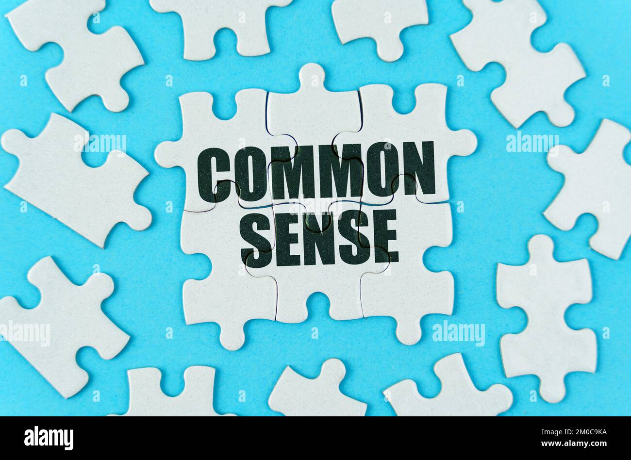 Medical concept. On a blue background are white puzzles with the ...