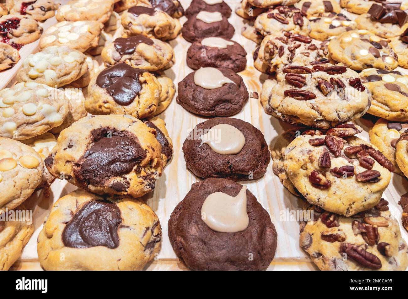 Handmade chocolate chip biscuits with toppings Stock Photo - Alamy
