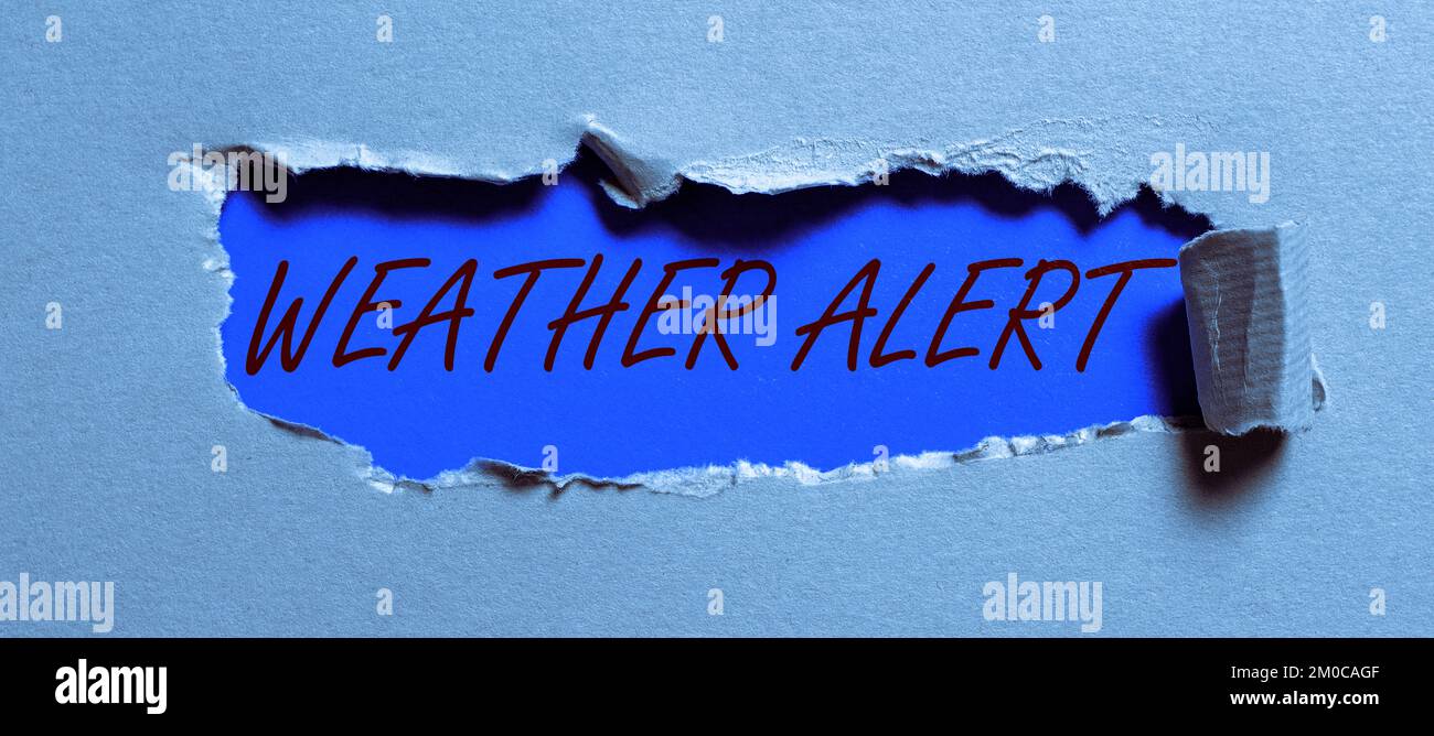 Hand writing sign Weather Alert. Internet Concept urgent warning on the ...