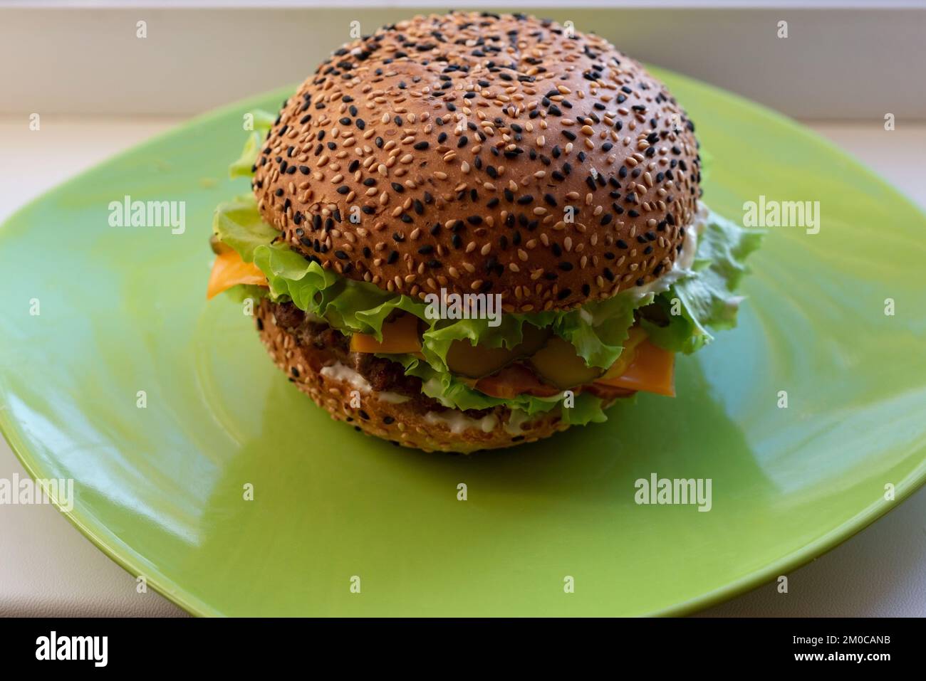 fast food burger junk food on a plate Stock Photo - Alamy