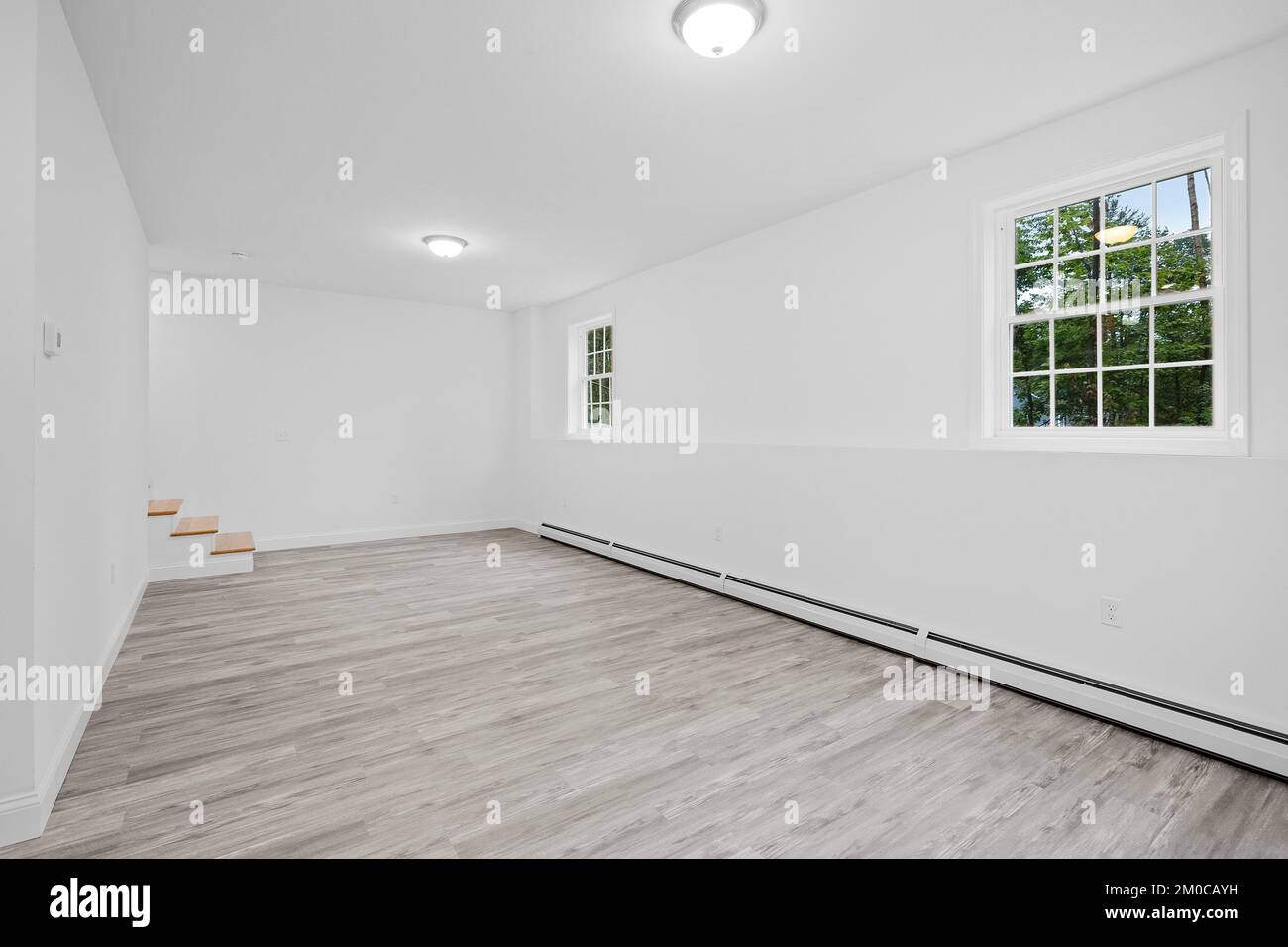 A white modern room without furniture and with small windows Stock ...