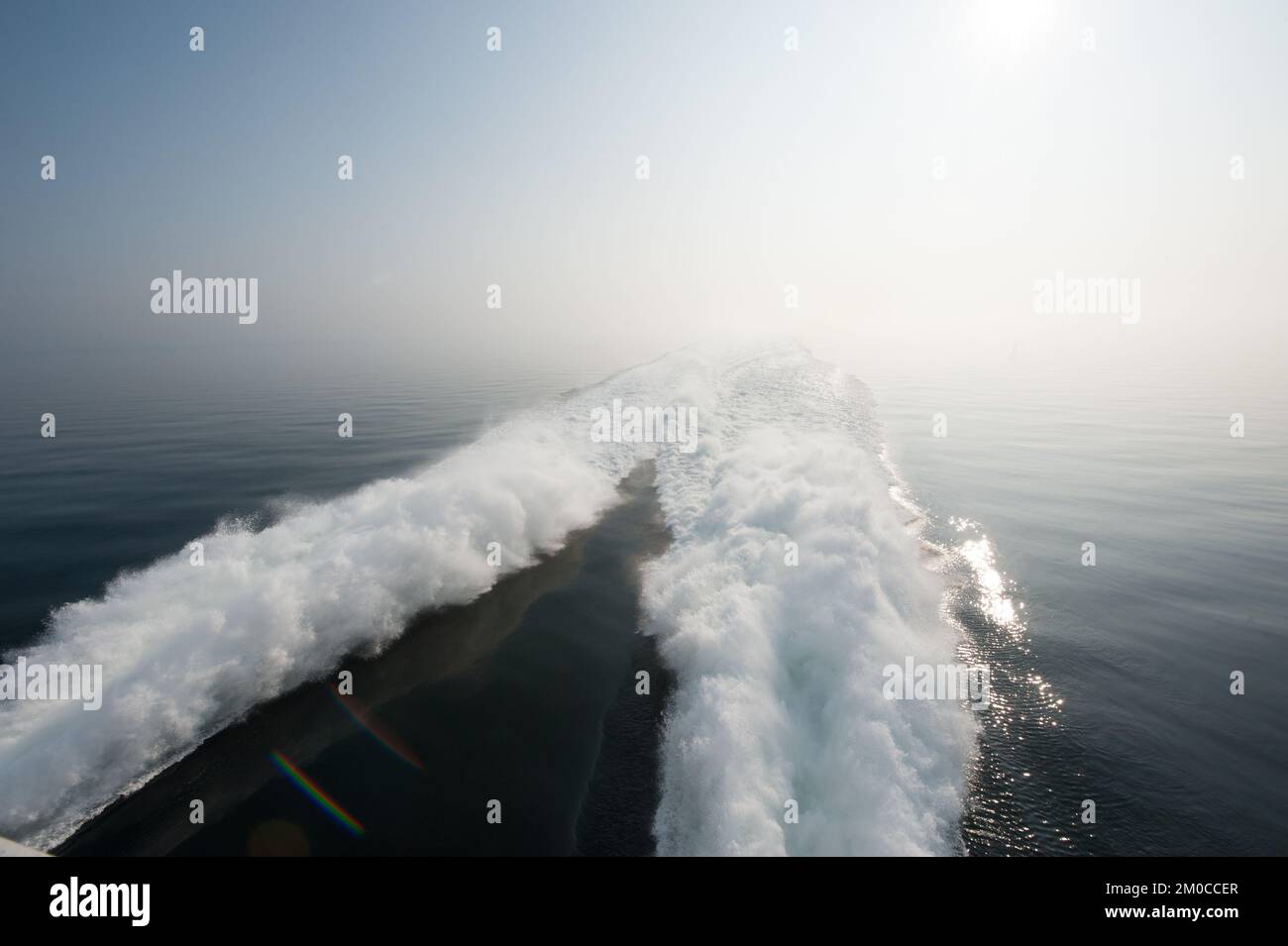 Wake of a fast ferry on calm sea Stock Photo - Alamy